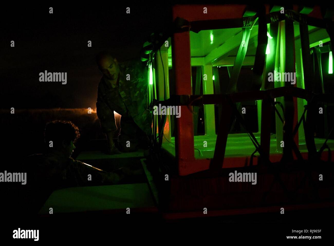 Air Commandos move cargo bundles onto a truck during Task Force ...
