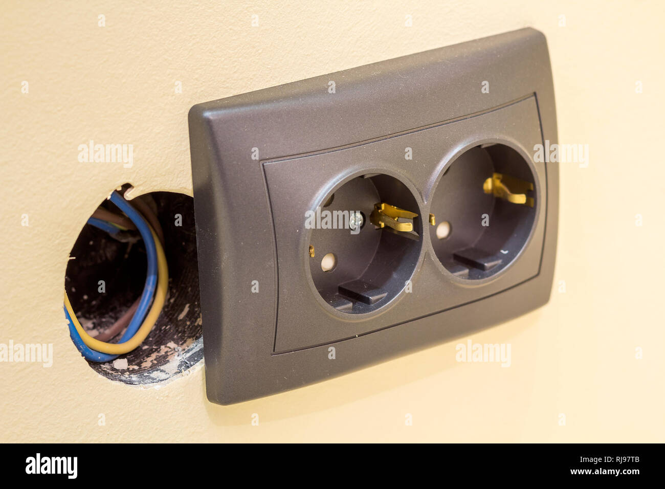 New gray power outlet socket with electric isolated colorful wires ...