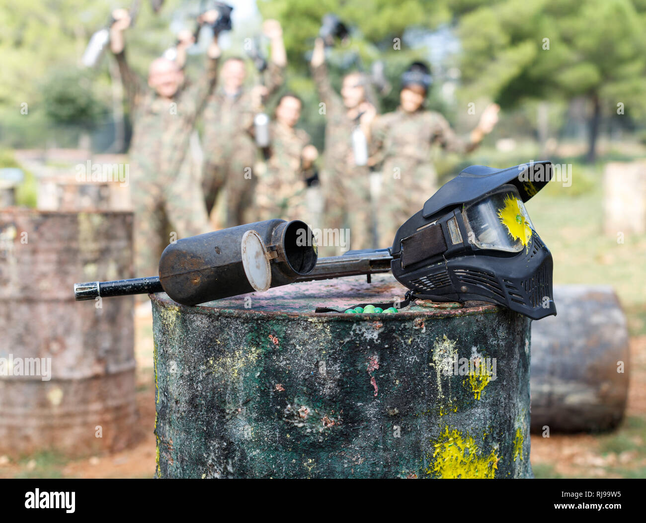 Paintball mask with splash after direct hit from marker gun lying on ...