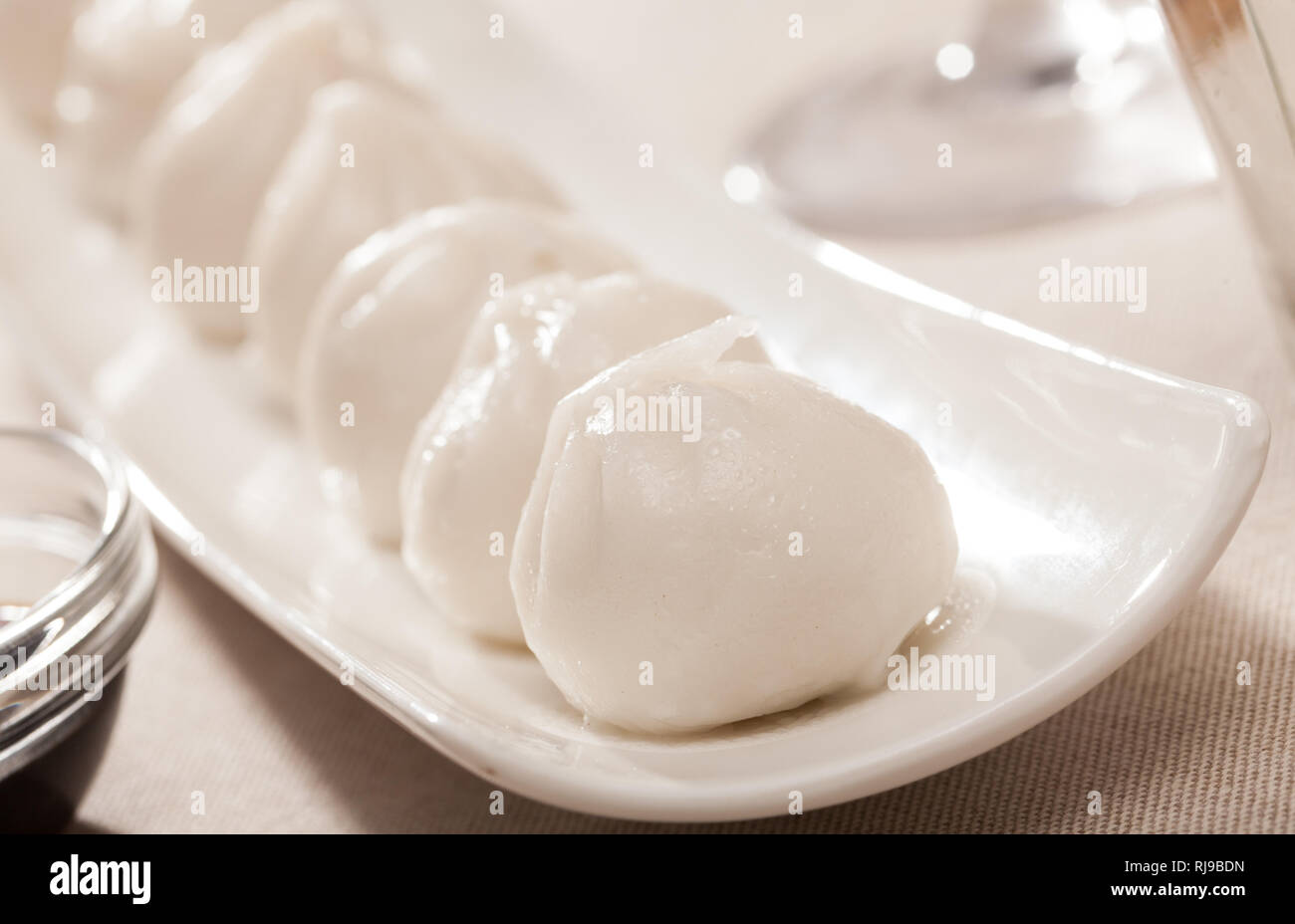 Delicious Chinese dish - steamed dim sum served on platter Stock Photo ...