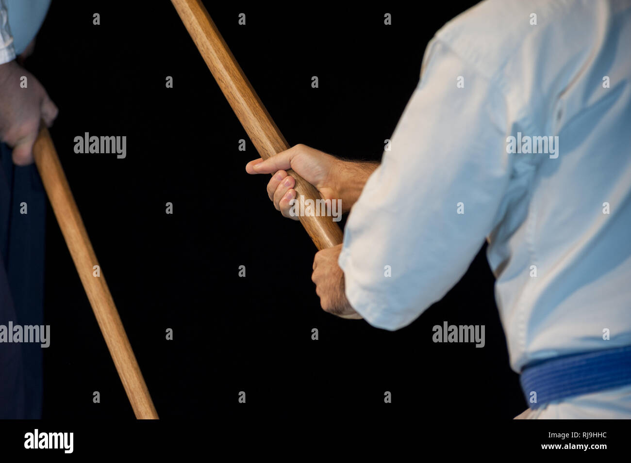 Aikido fighter with his wood stick during a combat Stock Photo - Alamy