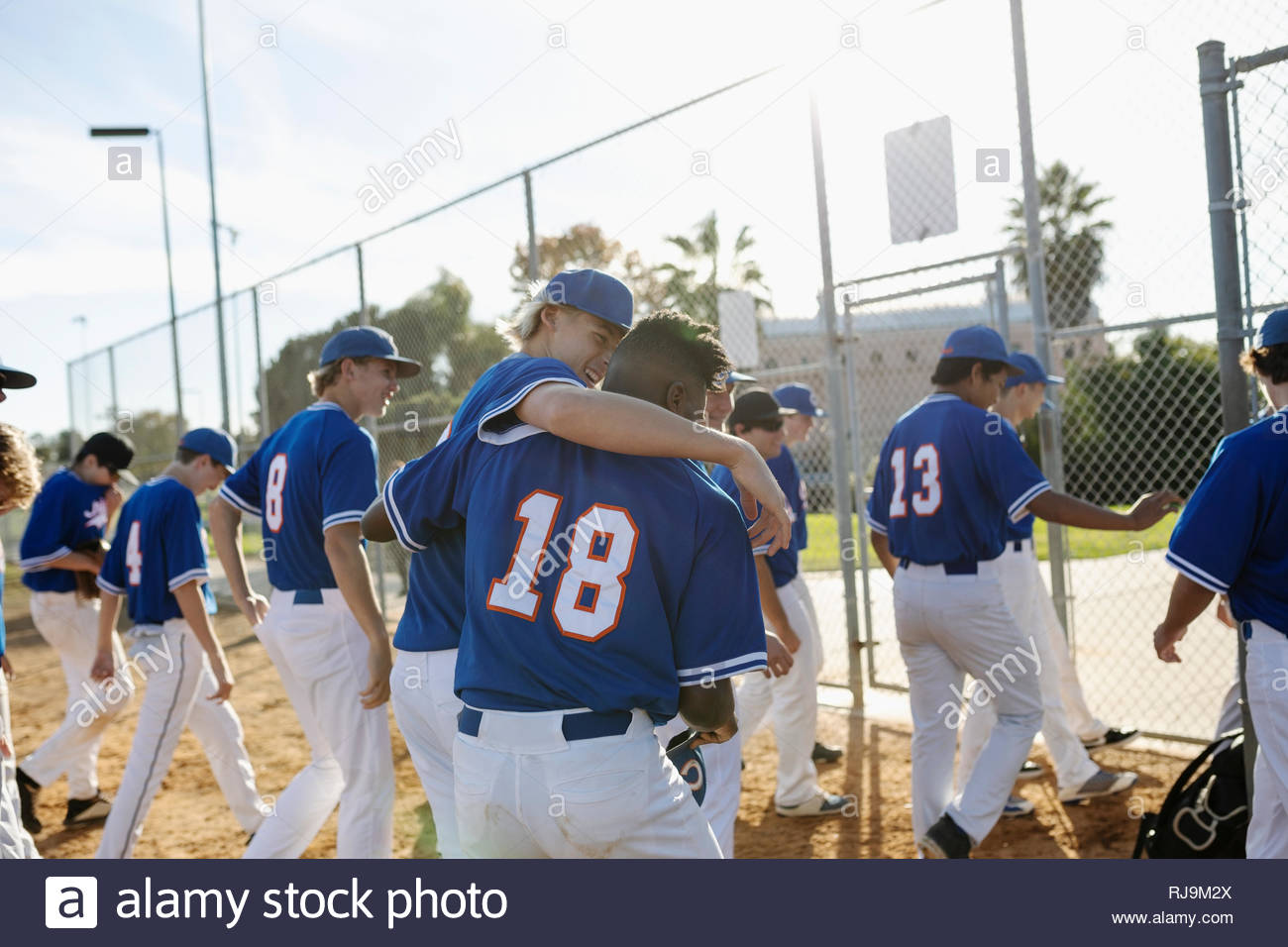Team hugging hi-res stock photography and images - Alamy