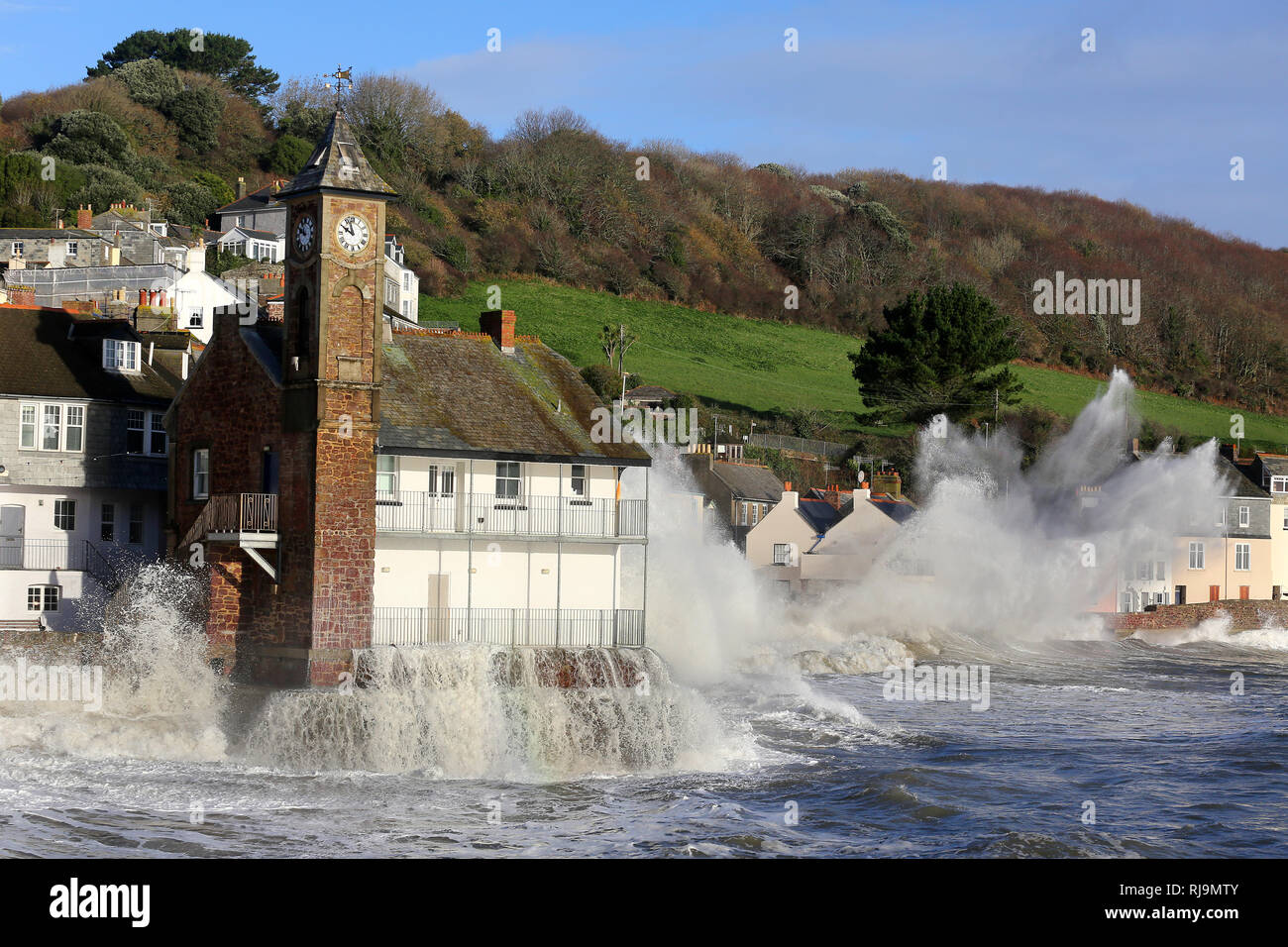 The clock tower at Cawsand in Cornwall takes a battering from the waves ...