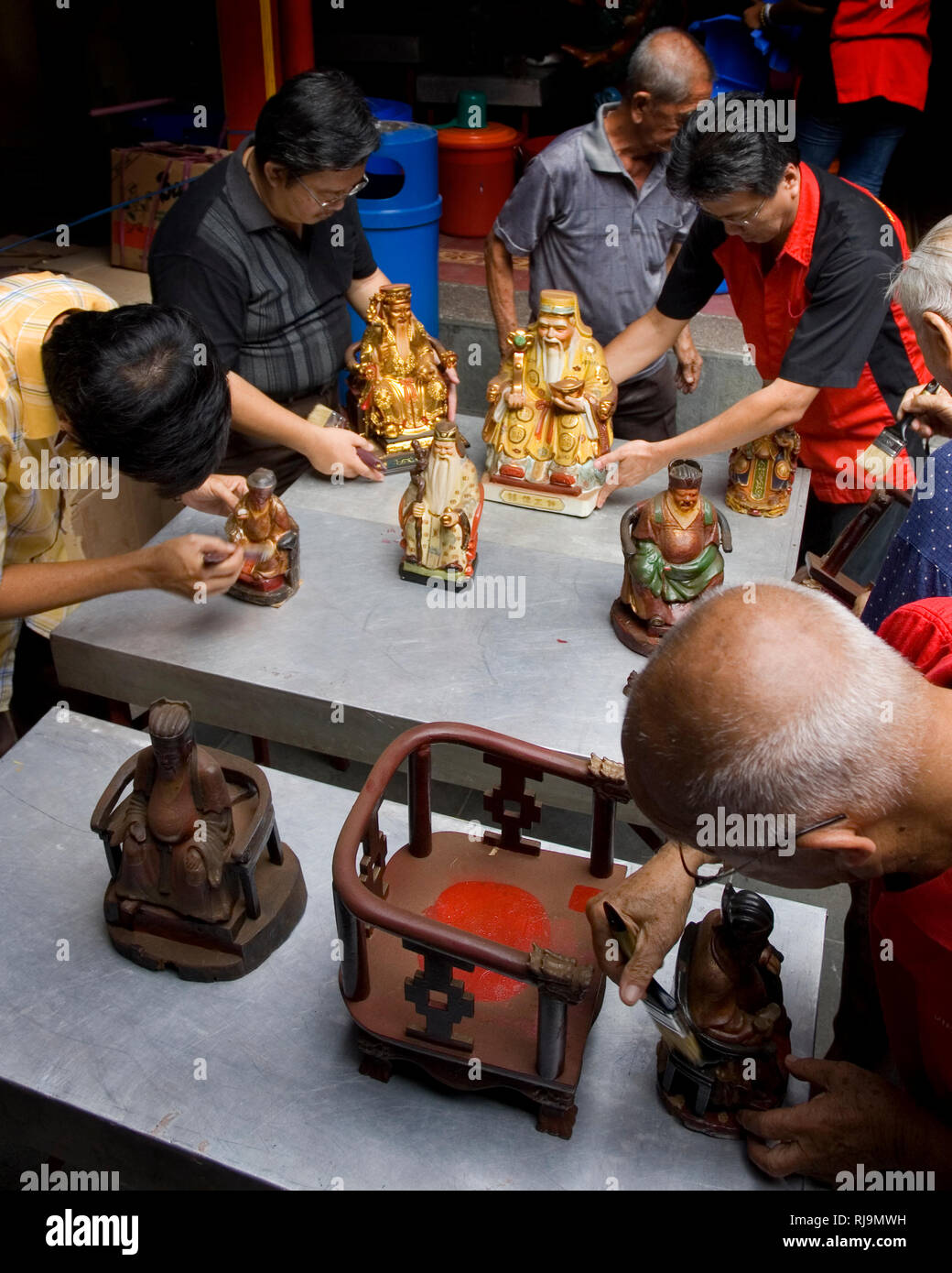 Prior to Chinese New Year, a group of Buddhist people are cleaning the ...