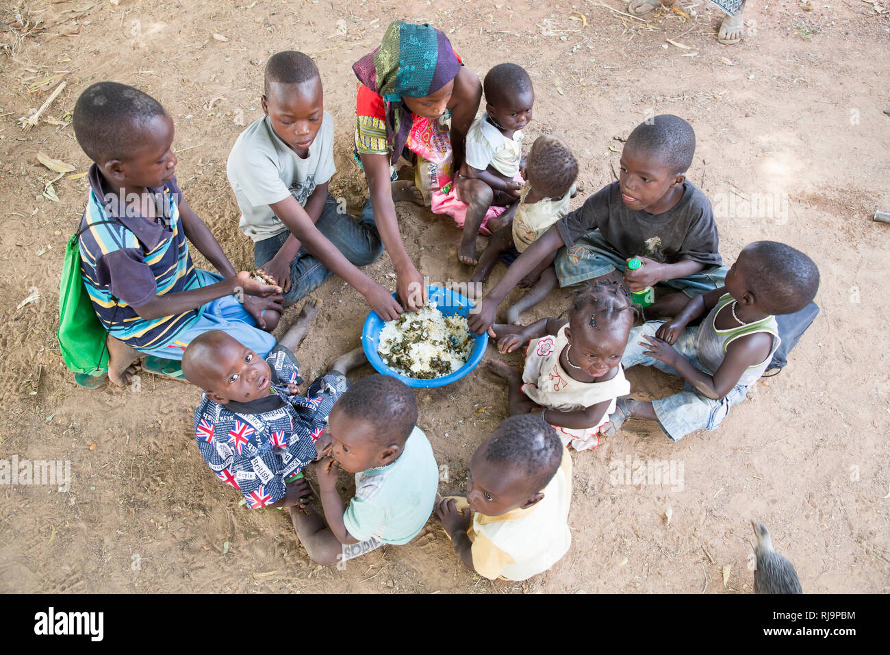 Child eating rice africa hi-res stock photography and images - Alamy