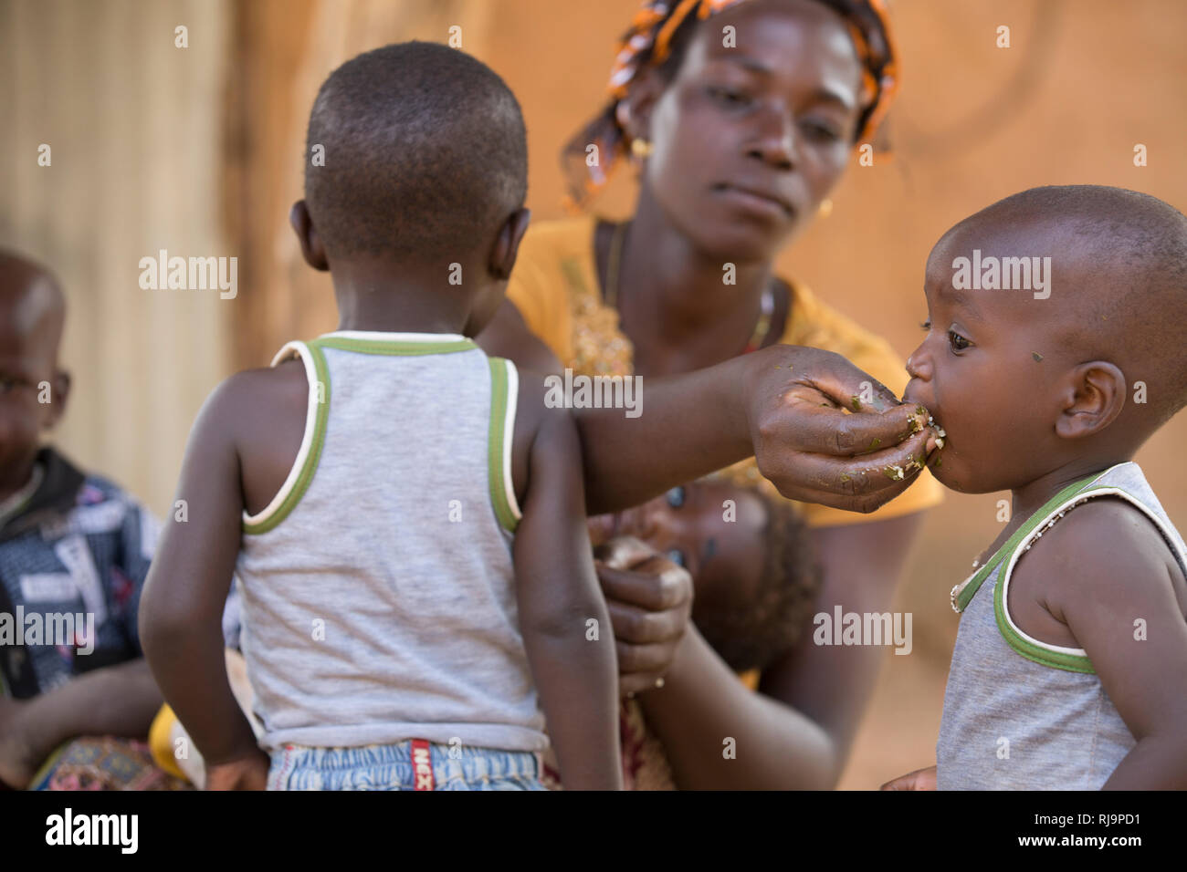 Child eating rice africa hi-res stock photography and images - Alamy