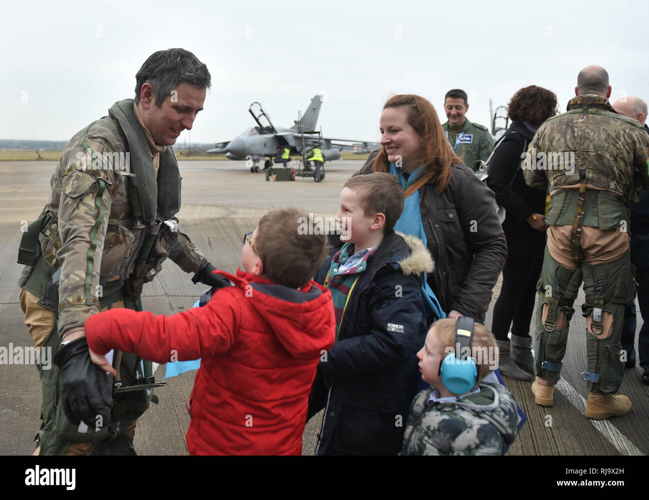 Officer Commanding IX Squadron Wing Commander James Heeps is greeted by ...