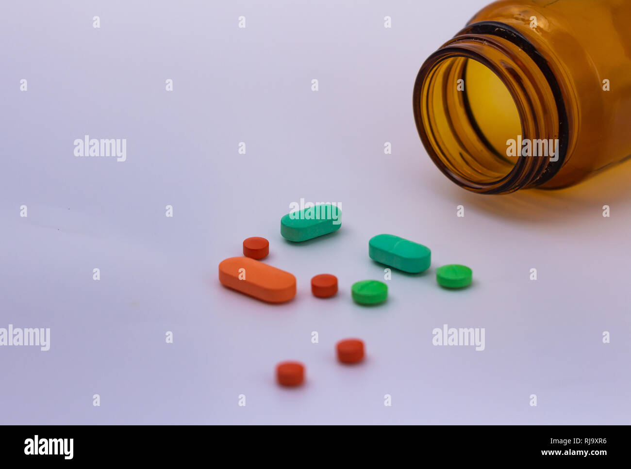 Pills of colors on neutral background. Legal drugs from the ...