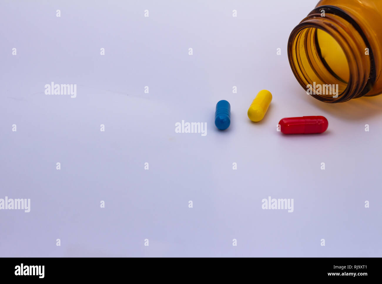 Pills of colors on neutral background. Legal drugs from the ...