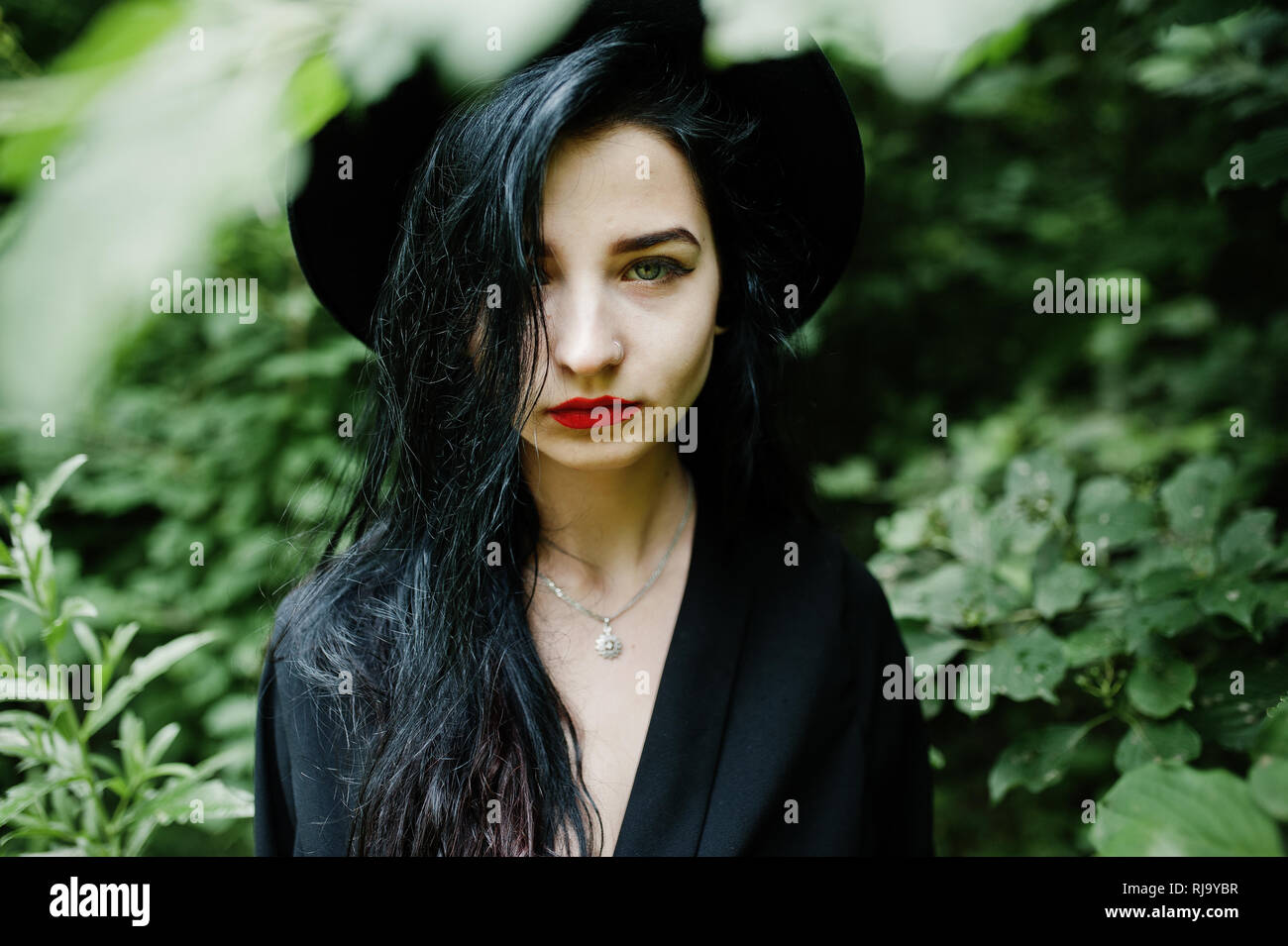 Close Up Portrait Of Sensual Girl All In Black Red Lips And Hat Goth Dramatic Woman Stock