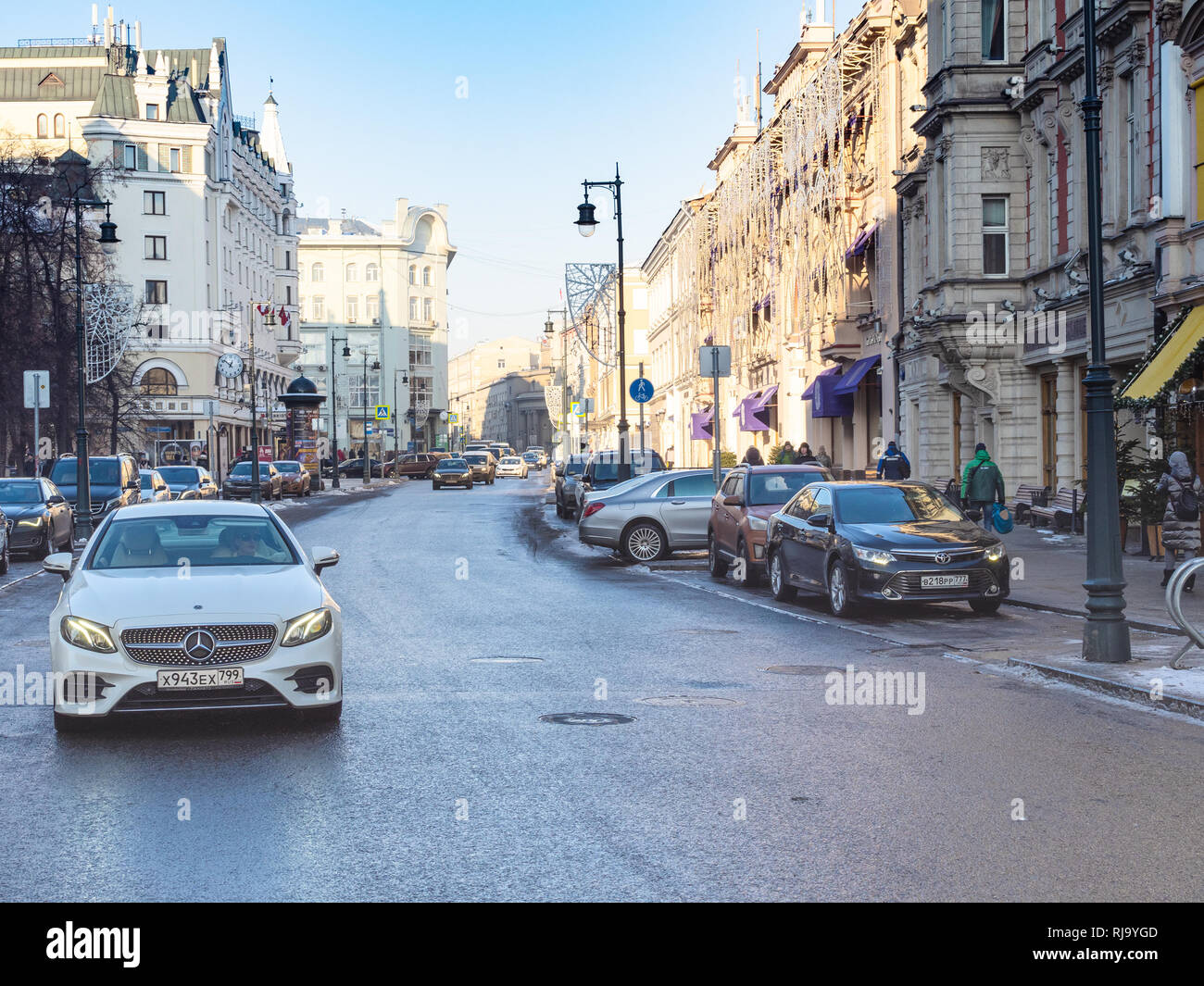 MOSCOW, RUSSIA - JANUARY 24, 2019: car and people on Petrovka Street in ...