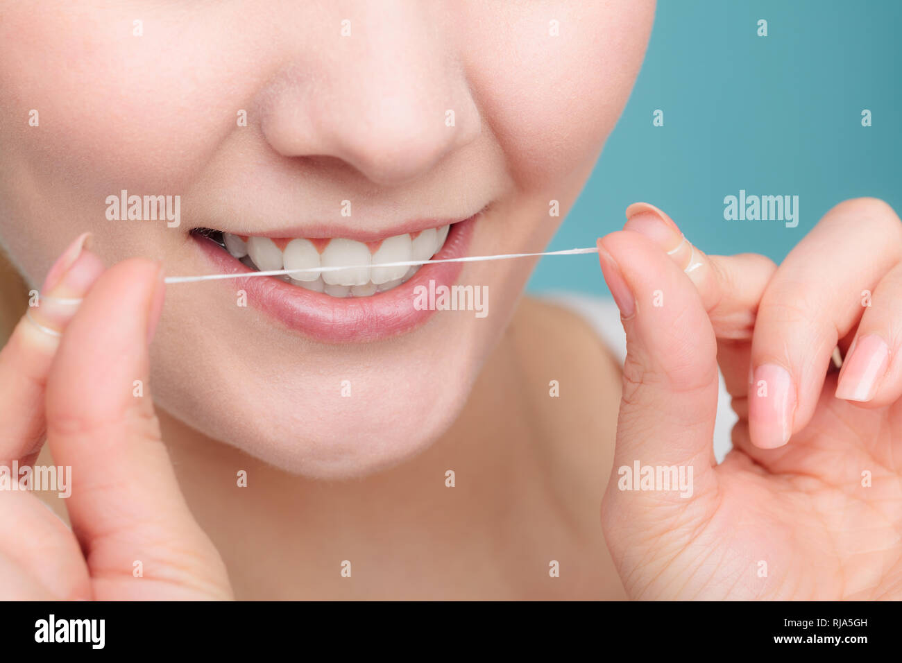 Oral hygiene and health care. Smiling women use dental floss white ...