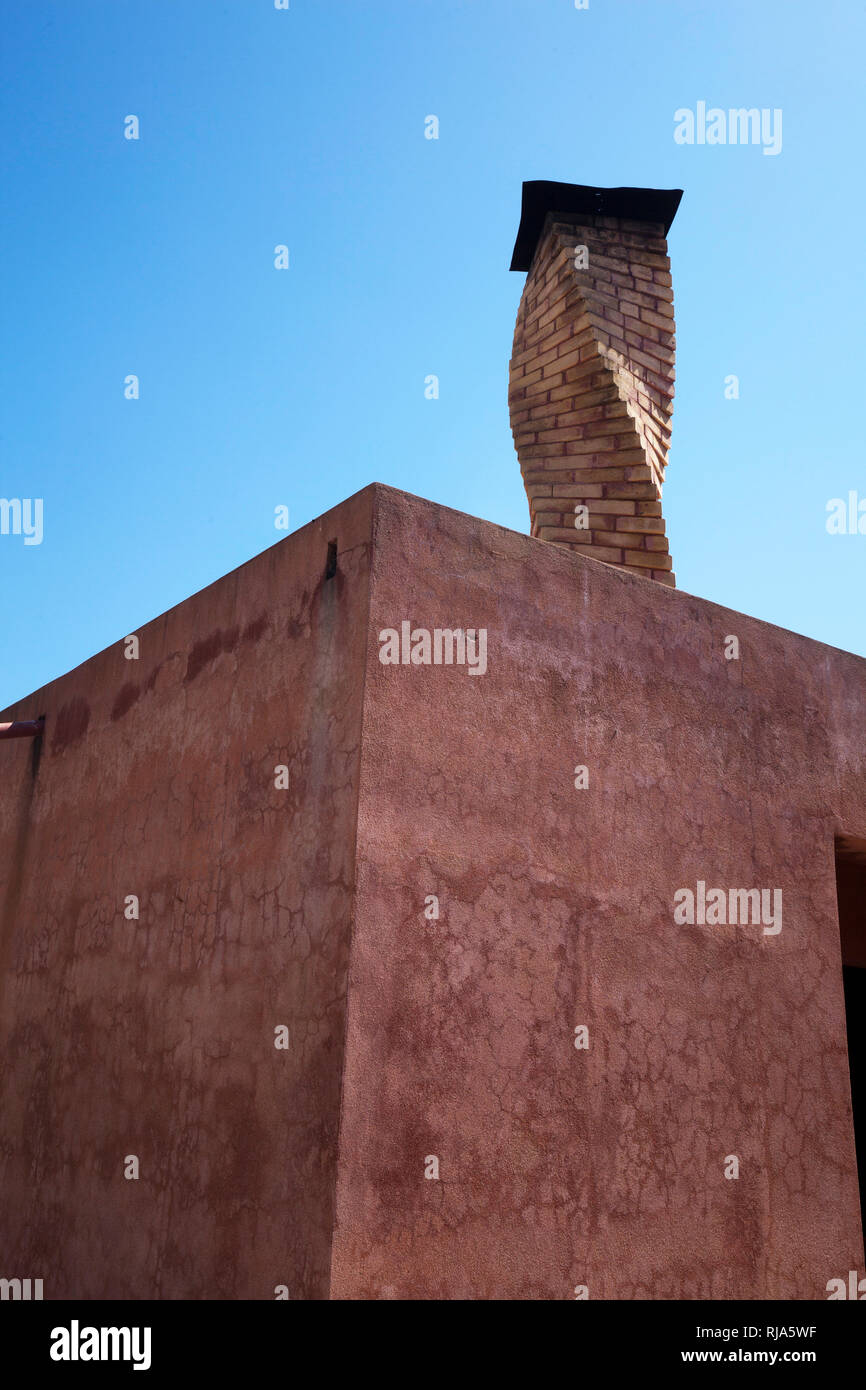 curious twisted chimney on flat roof in Greece Stock Photo - Alamy