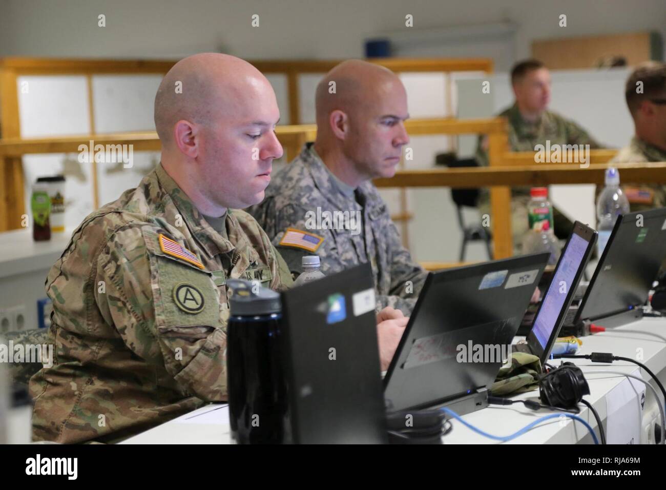 U.S. Soldiers of the 37th Infantry Brigade receive mission updates ...