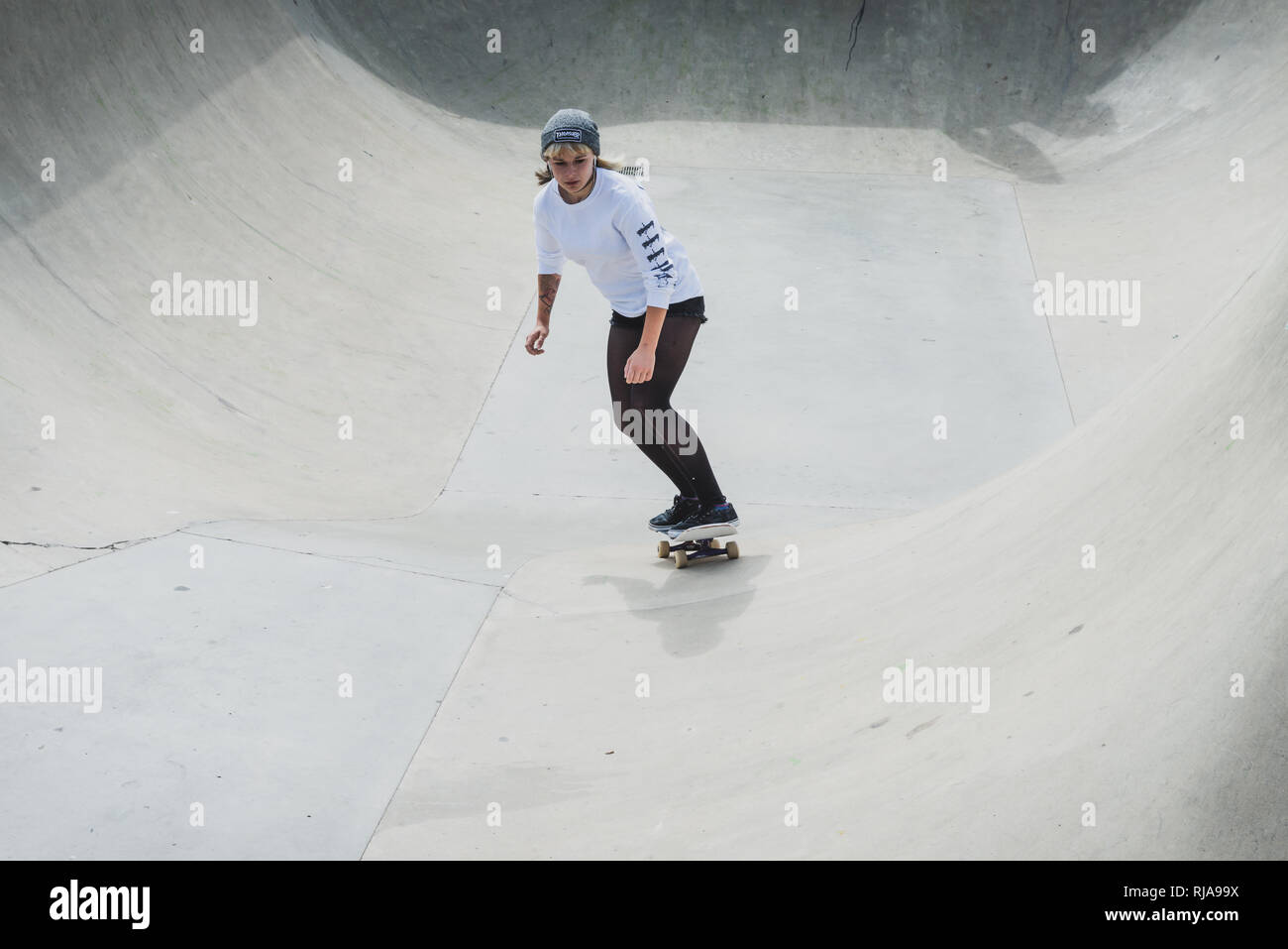 A teenage girl skating at The Level Skatepark in Brighton, East Sussex ...