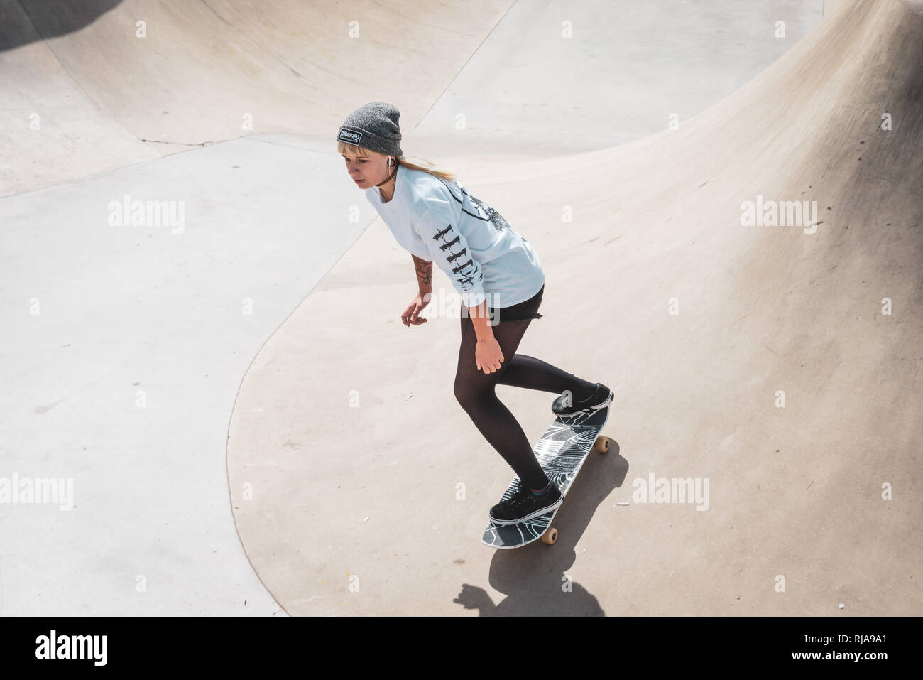A teenage girl skating at The Level Skatepark in Brighton, East Sussex ...