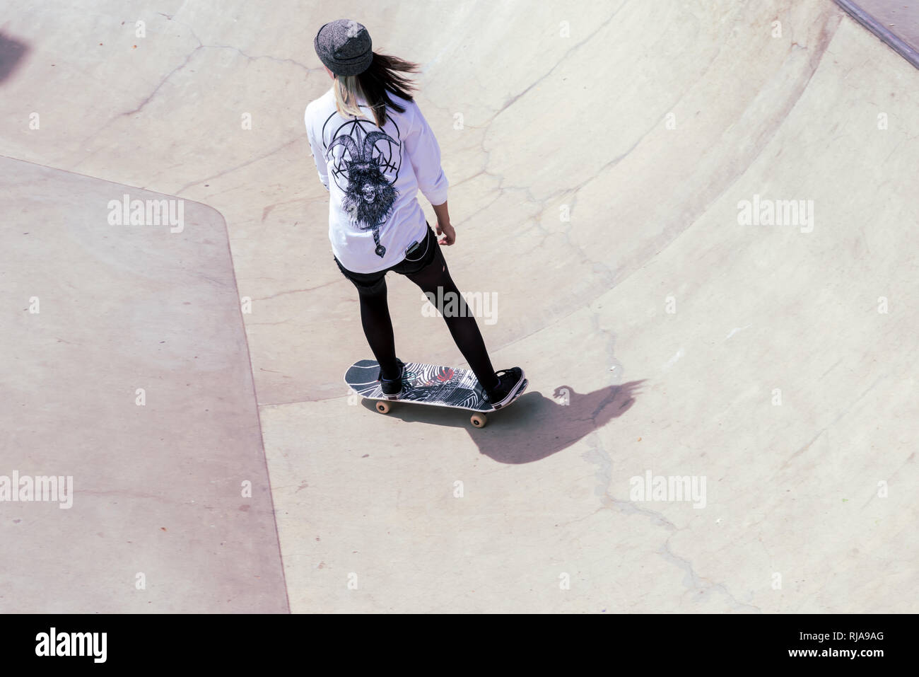 A teenage girl skating at The Level Skatepark in Brighton, East Sussex ...