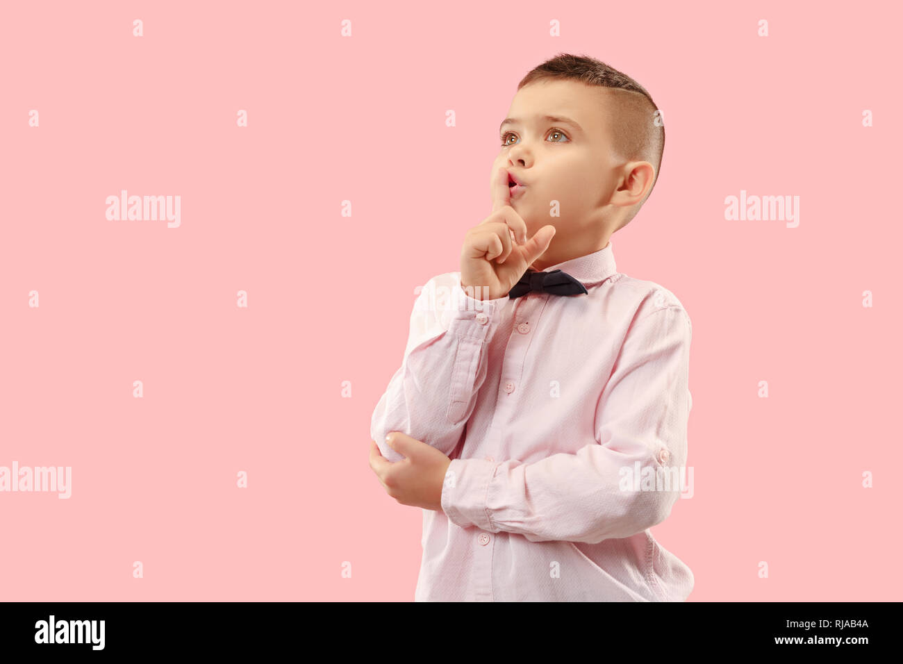 Secret, gossip concept. Teen boy whispering a secret behind his hand ...