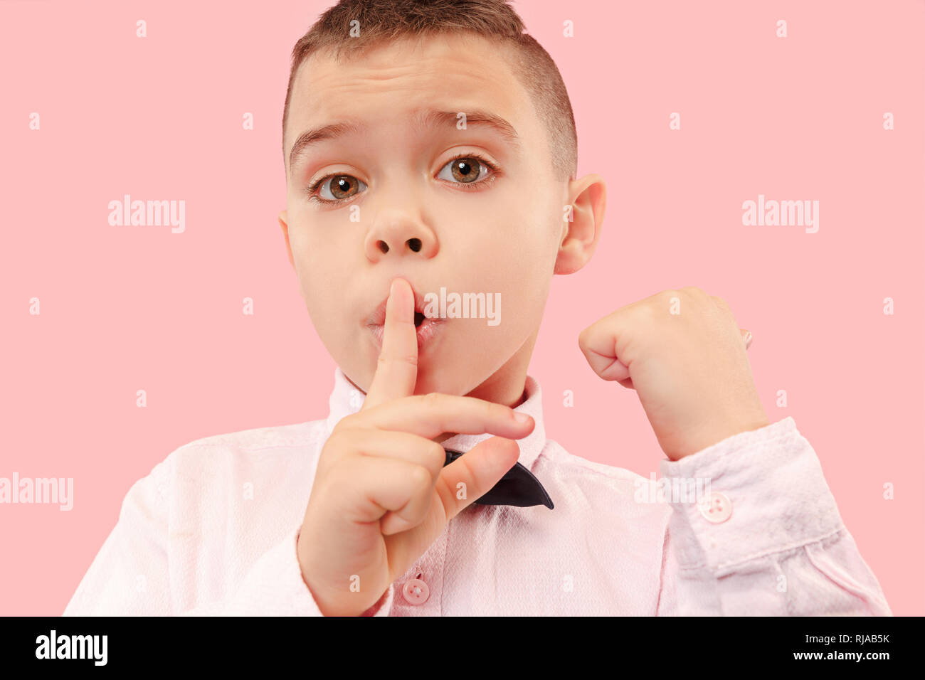 Secret, gossip concept. Teen boy whispering a secret behind his hand ...