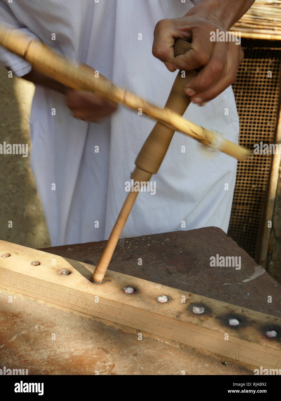 re-enacted scene of ancient Egyptian fire making, using a drill and ...