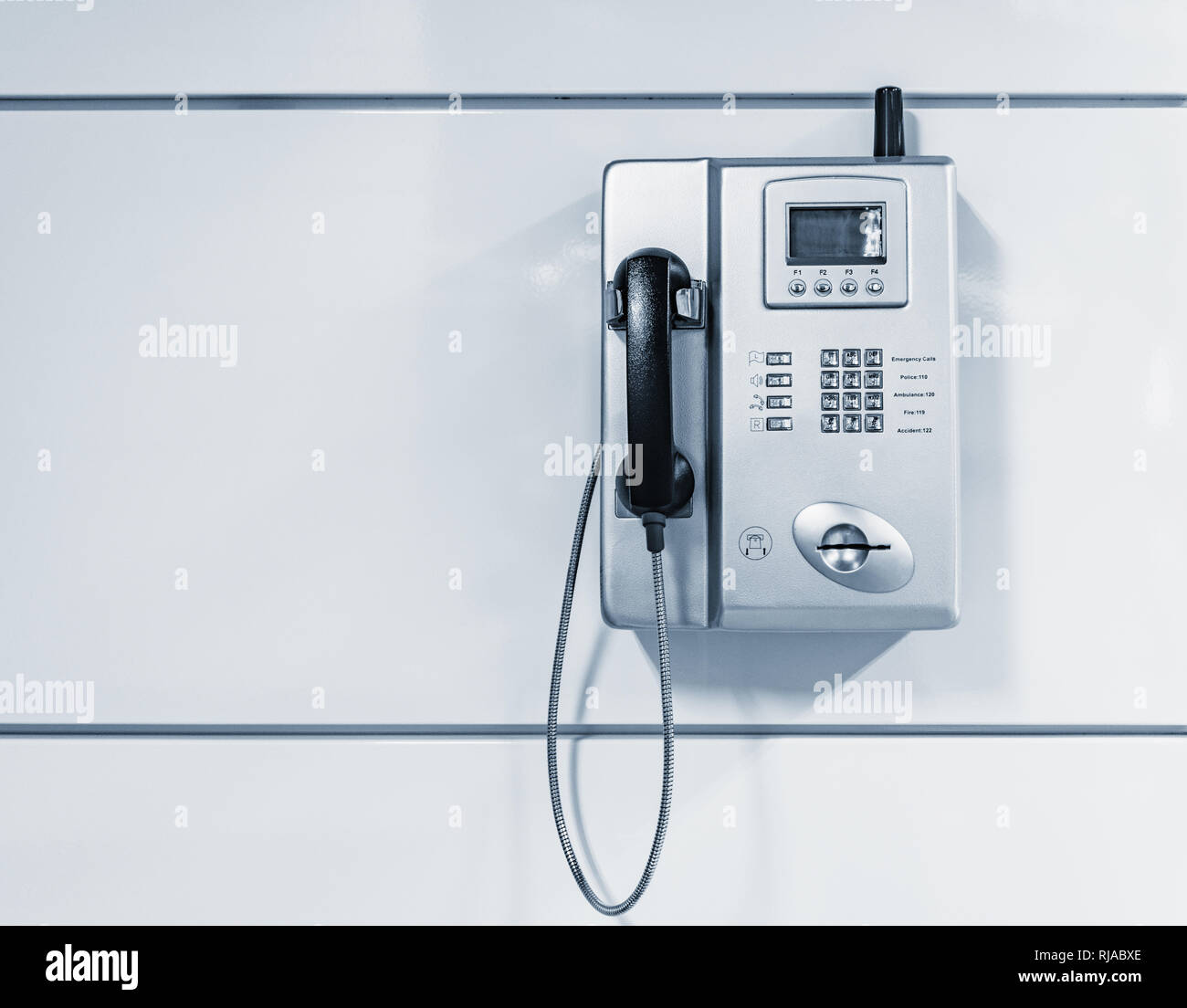 Pay telephone on the wall in the hotel lobby Stock Photo - Alamy