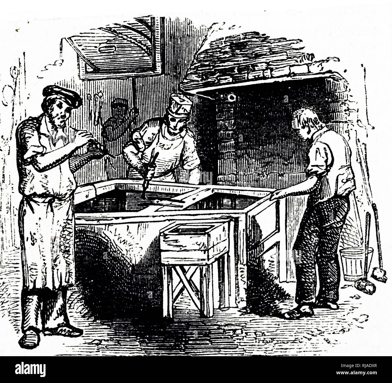 An engraving depicting the hardening on tempering files by firing and ...