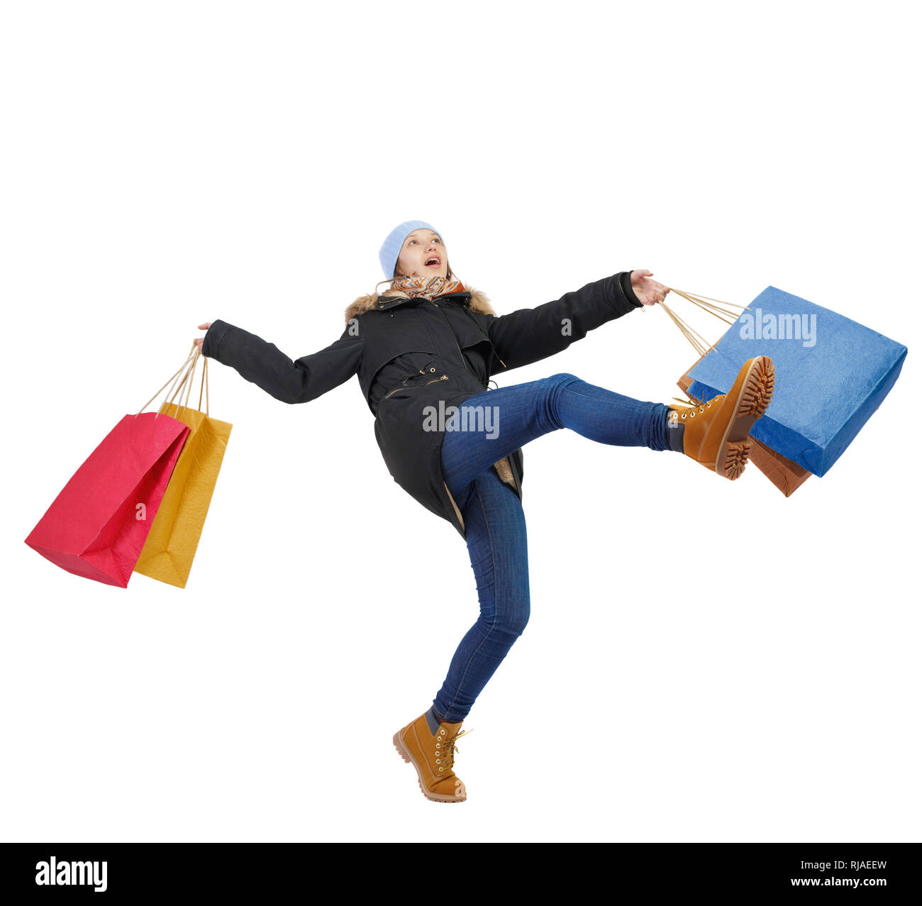 Falling woman with shopping bags. beautiful girl in motion. backside ...