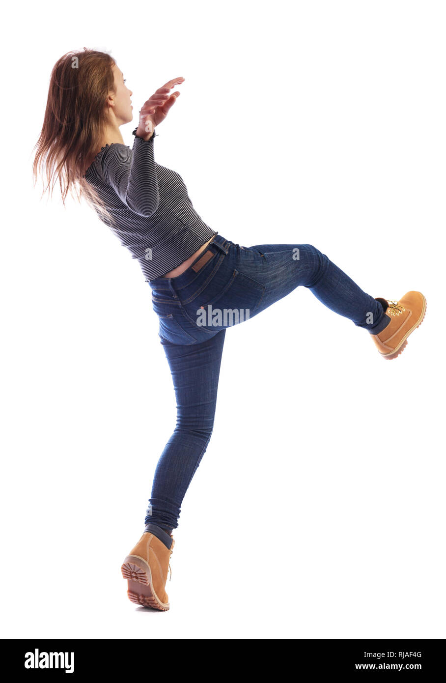 Balancing young woman. or dodge falling woman. Rear view people ...