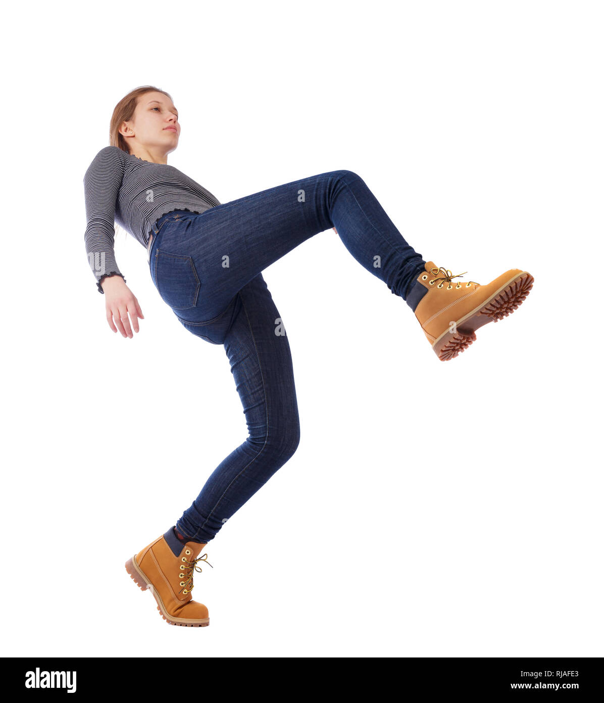 Balancing young woman. or dodge falling woman. Rear view people ...