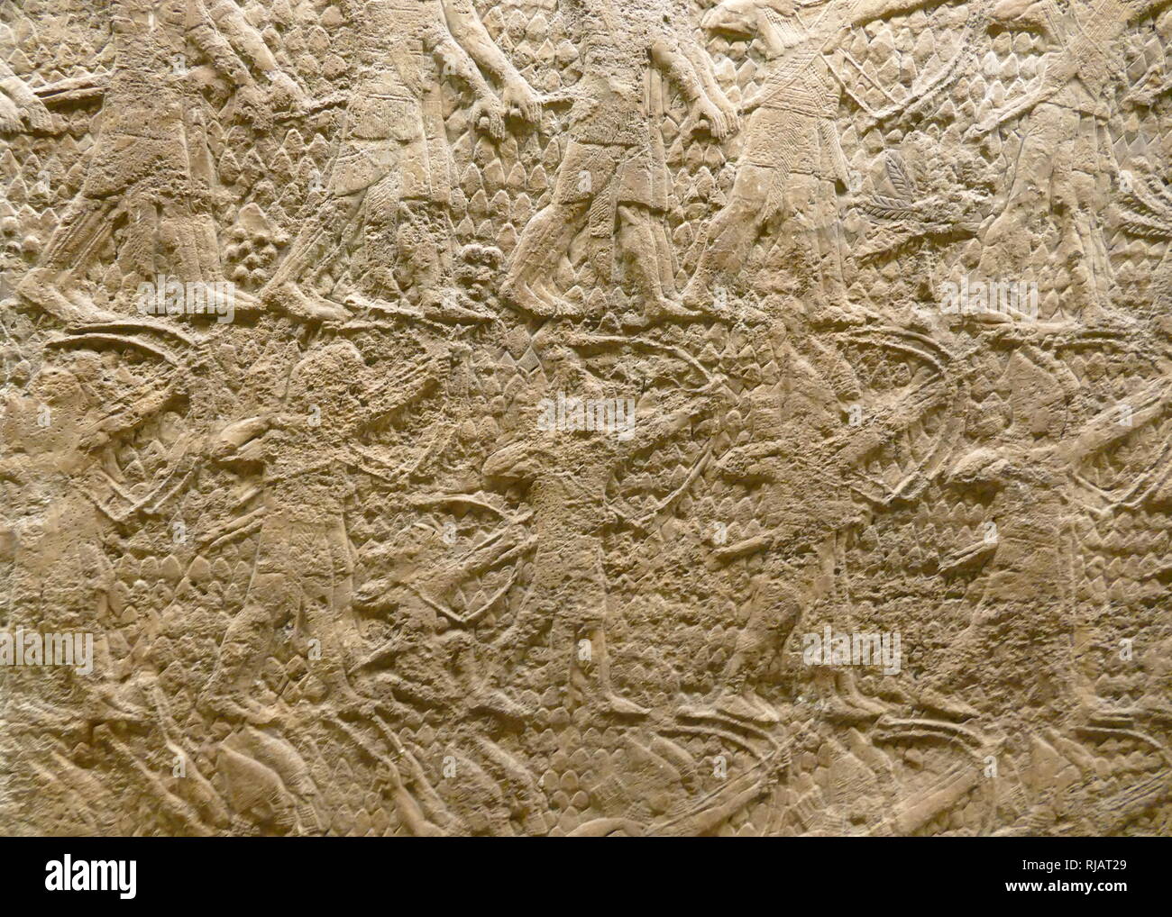 Stone carved relief depicting an attack on Lachish. Assyrian, about 700 ...