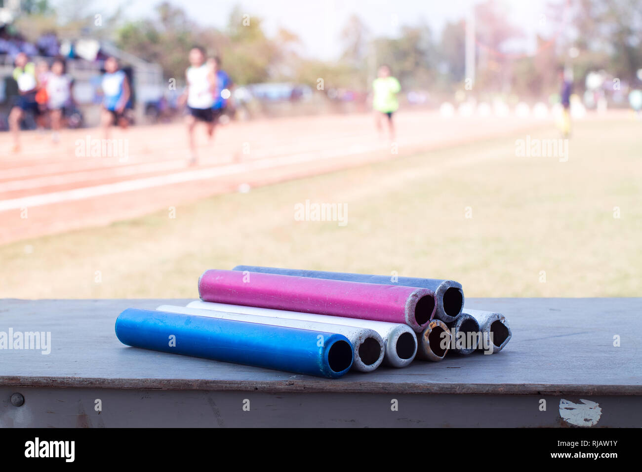 The group of baton in Athletics Stock Photo - Alamy