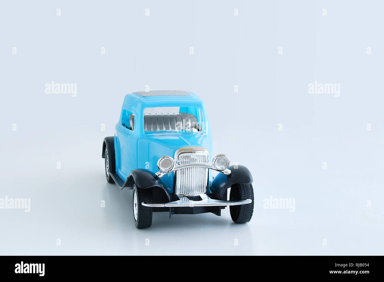 Children blue plastic retro car. White background. Close-up Stock Photo ...