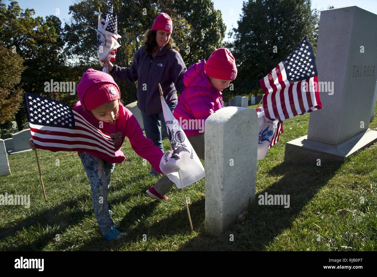 Coast Guard member Melissa Ransom and her daughters take part in "Flags ...