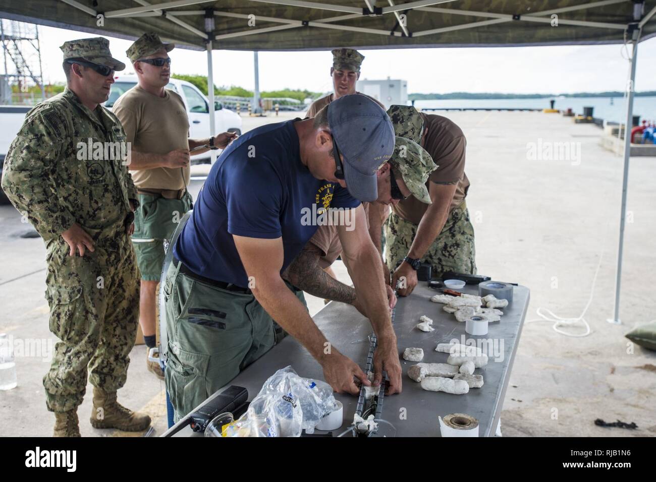 Members of Underwater Construction Team (UCT) 2's Construction Dive ...