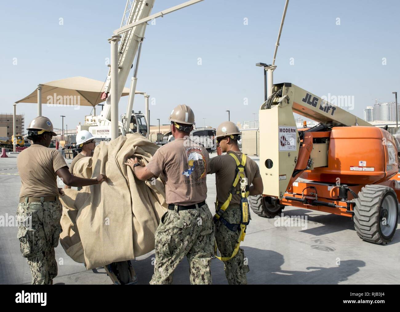 Sailors assigned to Naval Mobile Construction Battalion (NMCB) 11 ...