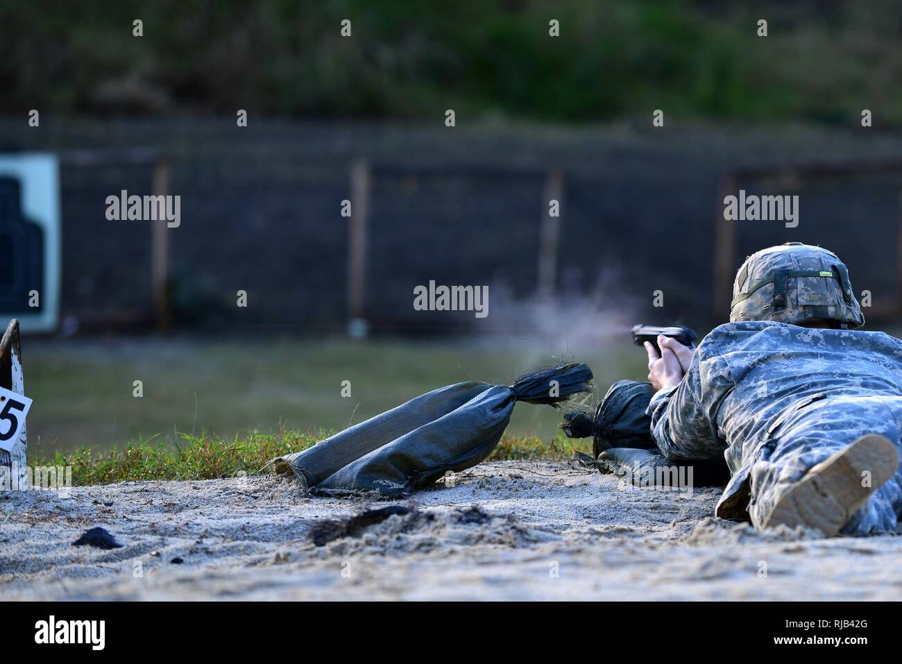 An U.S. Army Soldier fires a 9 mm Beretta automatic pistol in the ...