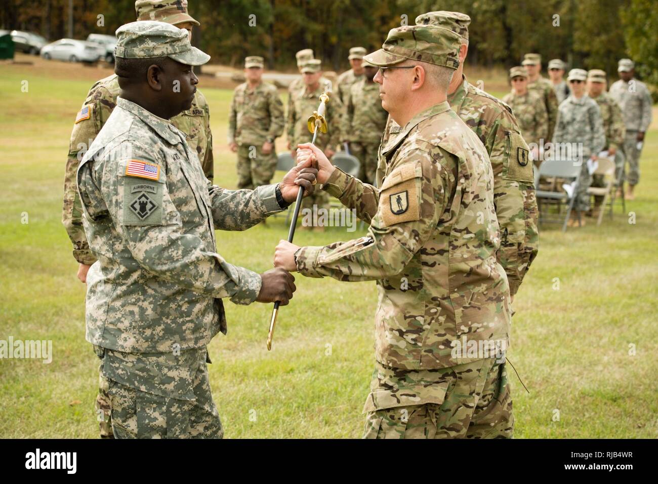 Command Sgt. Maj. Billy Ward (left), resident of Helena, Ark., accepts ...