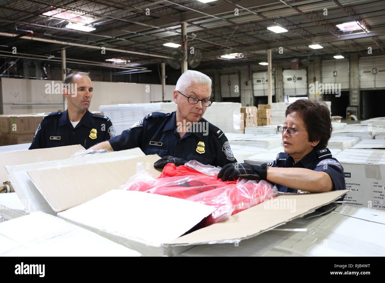 From left, U.S. Customs and Border Protection officers Sean Neely ...