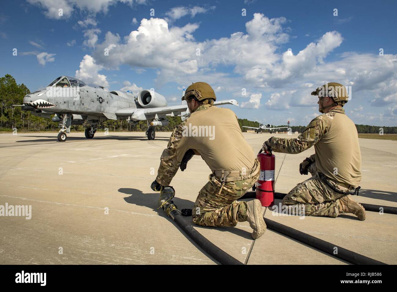 Staff Sgt. Brandon Earl, left, and Staff Sgt. Christopher Dessi, 23d ...