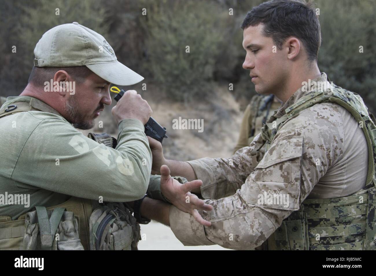 Tim Scarrott, left, a firearms instructor with Direct Action Group ...