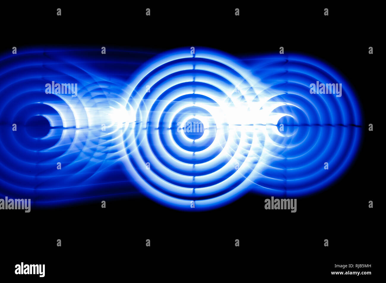 Sound waves in the visible blue color in the dark Stock Photo - Alamy