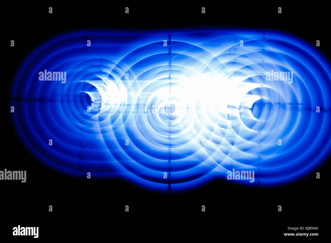 Sound waves in the visible blue color in the dark Stock Photo - Alamy