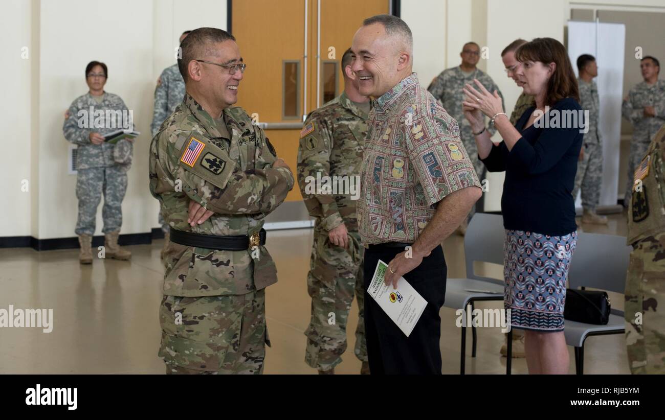 Brig. Gen. Keith Y. Tamashiro greets Maj. Gen. Bruce E. Olivera (ret ...