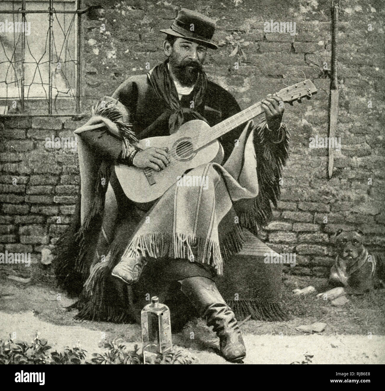 Man (gaucho or cowboy) playing a guitar, Argentina, South America Stock ...