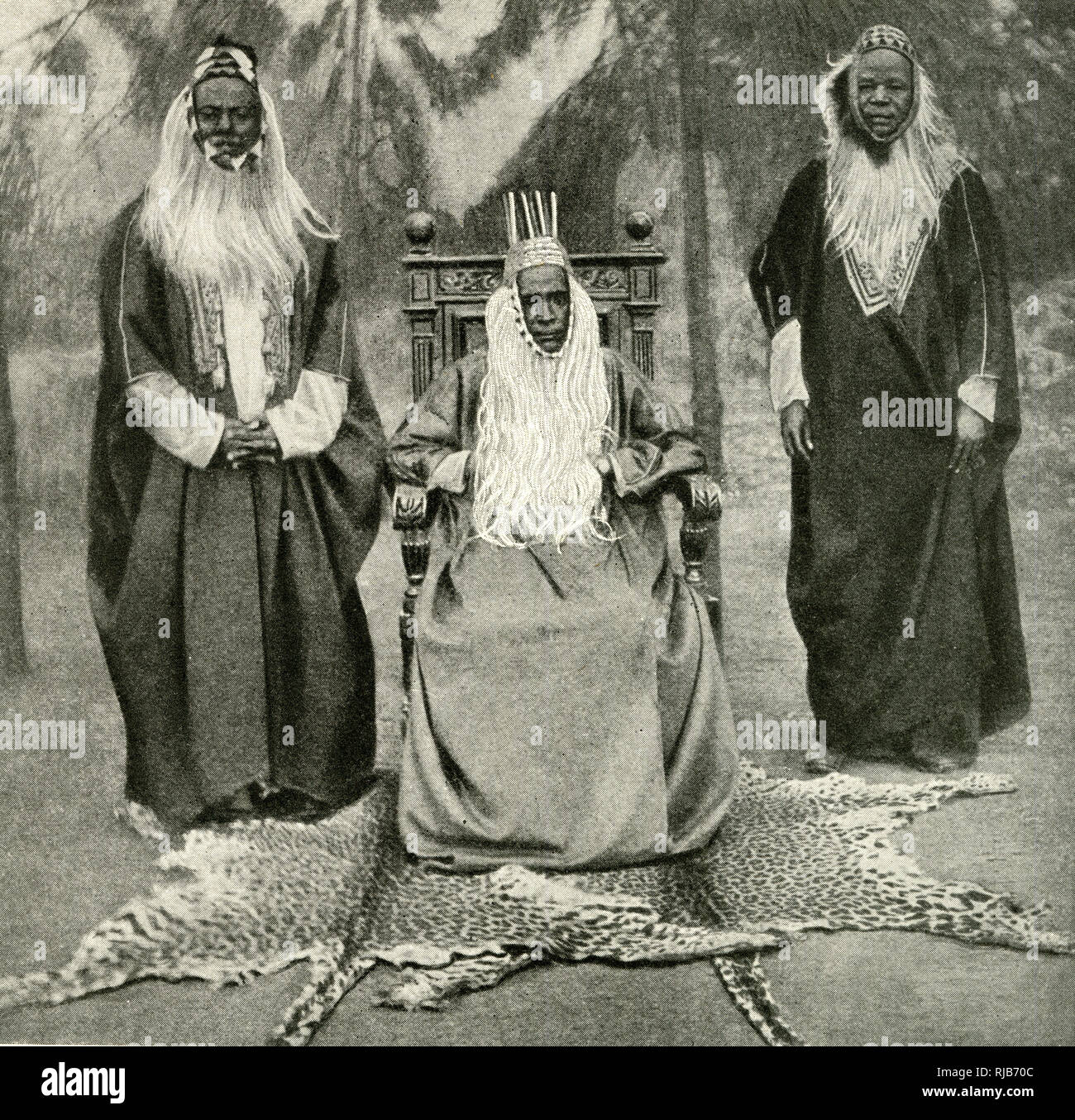 King of Bunyoro and two chiefs, Western Uganda, East Africa Stock Photo ...