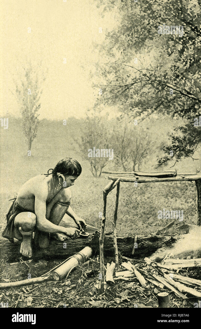 Kayan man preparing poison for blowpipe, Borneo, SE Asia Stock Photo ...