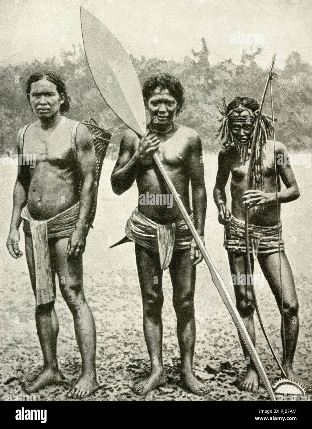 Three men of the Sakai tribe, equipped for hunting, Malay States, South ...