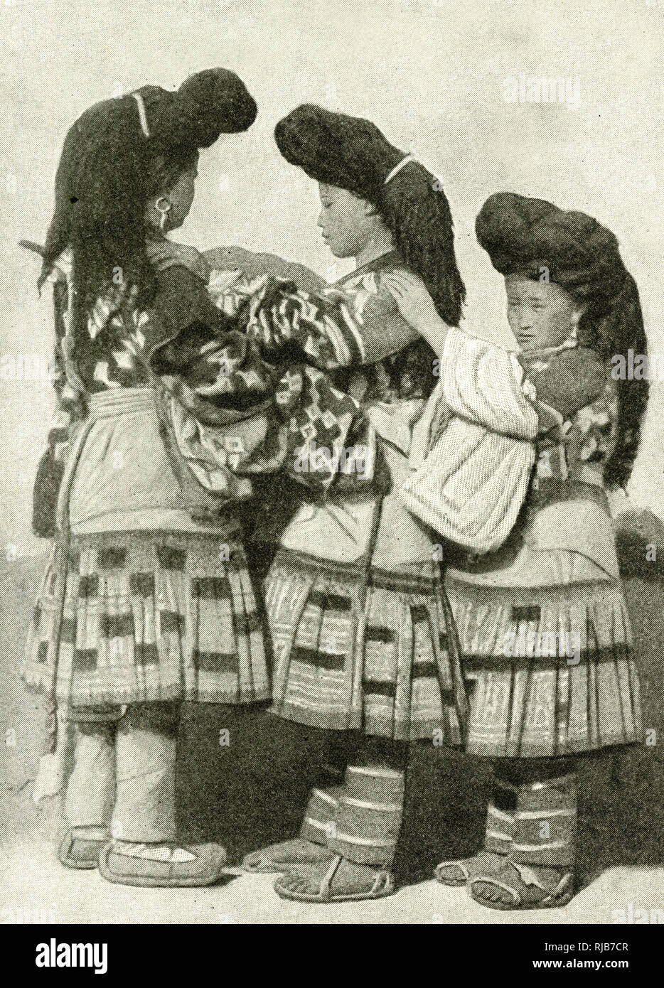 Nosu girls with large hairstyles, China, East Asia Stock Photo - Alamy