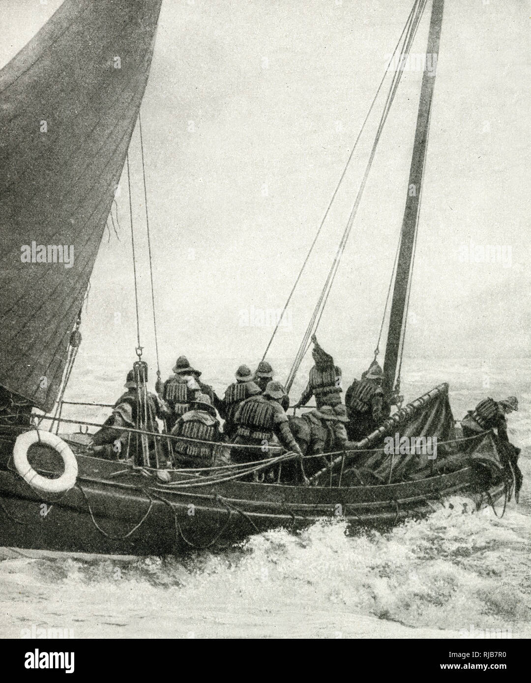 Lifeboat crew in action at sea, English coast Stock Photo - Alamy