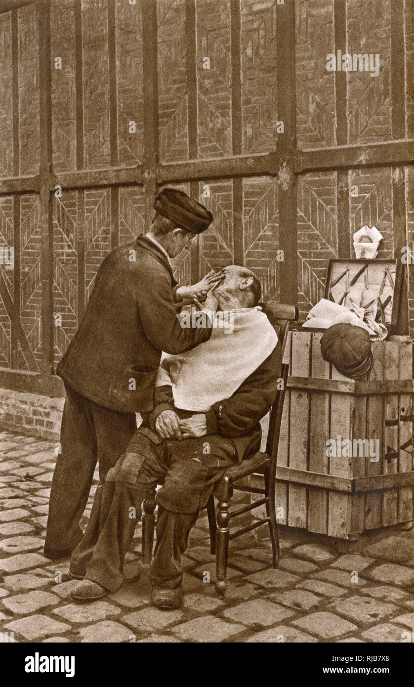 Barber in action, Rouen, Normandy, Northern France Stock Photo - Alamy